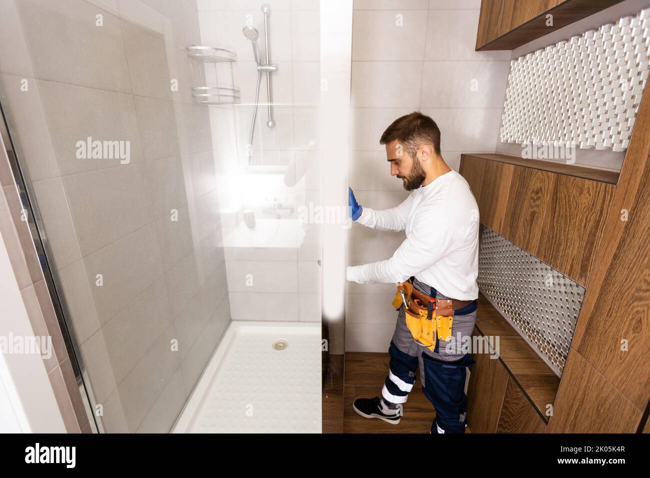 Professional plumber with plunger and instruments near sink Stock Photo ...