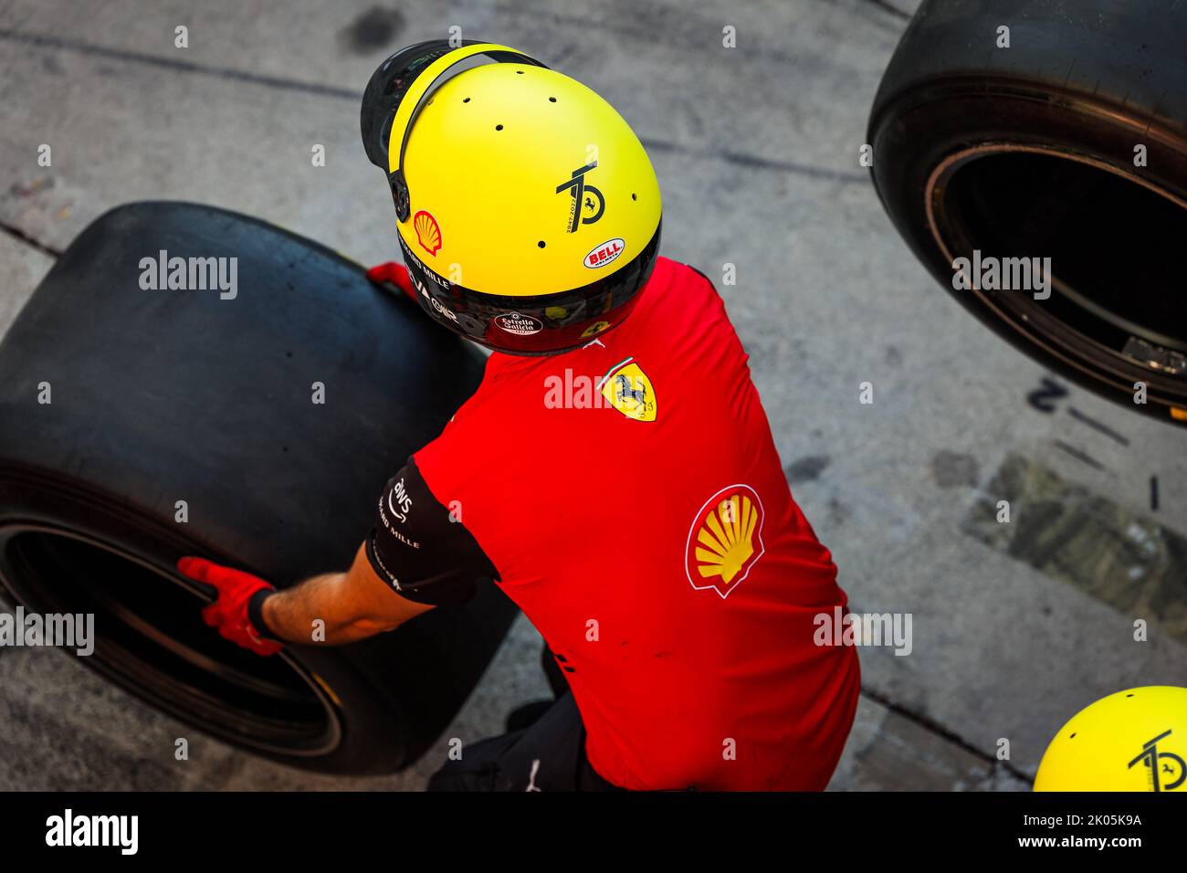 Scuderia Ferrari mechanics wearing the special livery clothes and ...