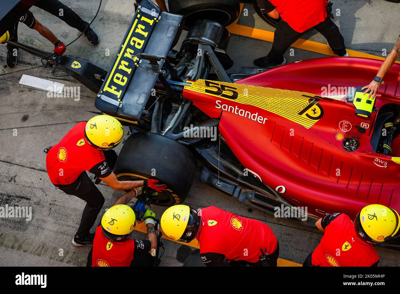 Scuderia Ferrari mechanics wearing the special livery clothes and ...