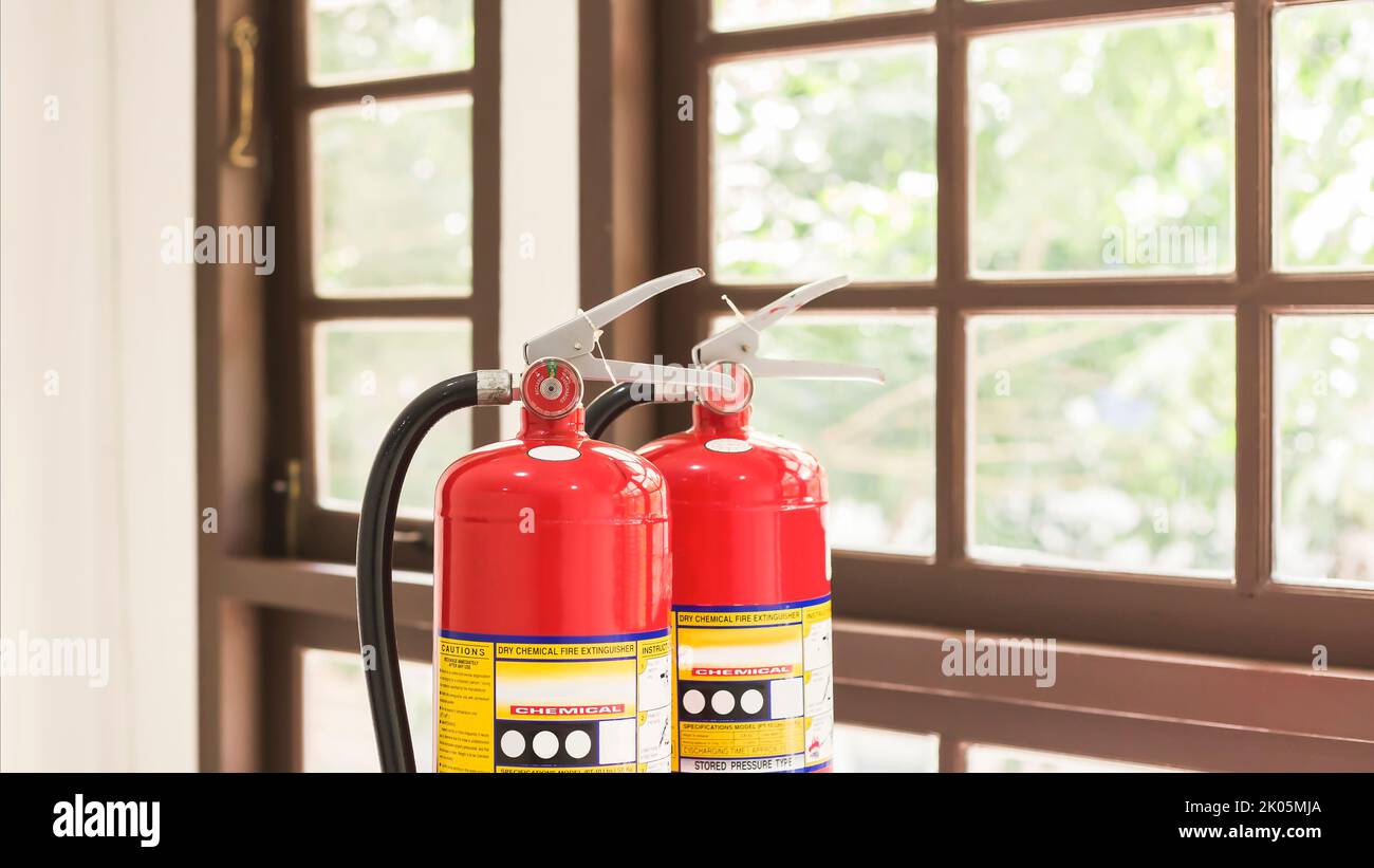The red fire extinguisher is ready for use in case of an indoor fire ...