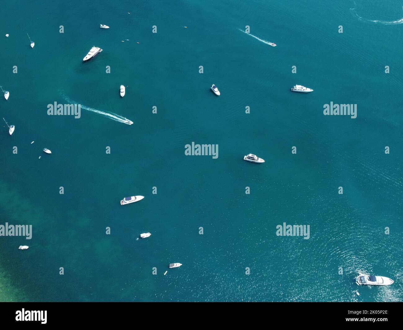 Aerial yacht on calm sea. Luxury cruise trip. View from above of white ...