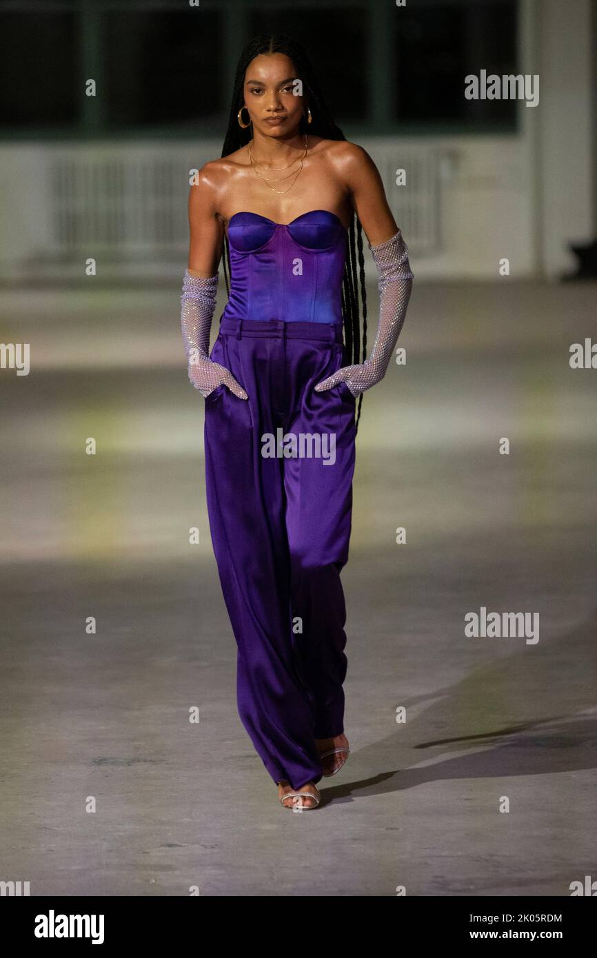 A model walks on the runway at the Fe Noel fashion show during the ...