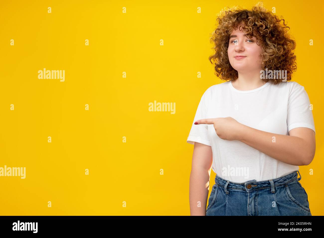 pointing woman commercial background overweight Stock Photo - Alamy
