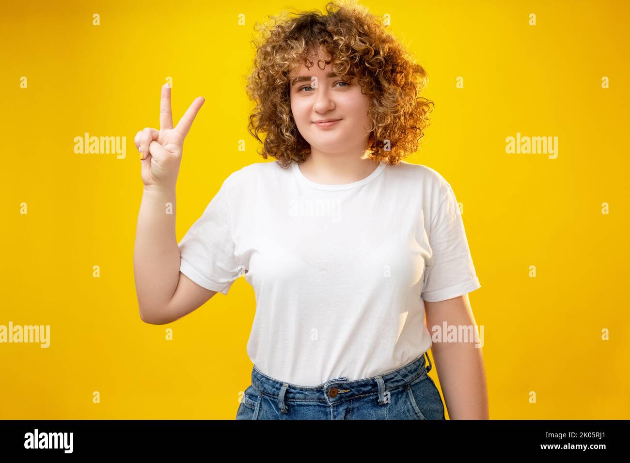 peace gesture body positive healthy overweight woman Stock Photo - Alamy