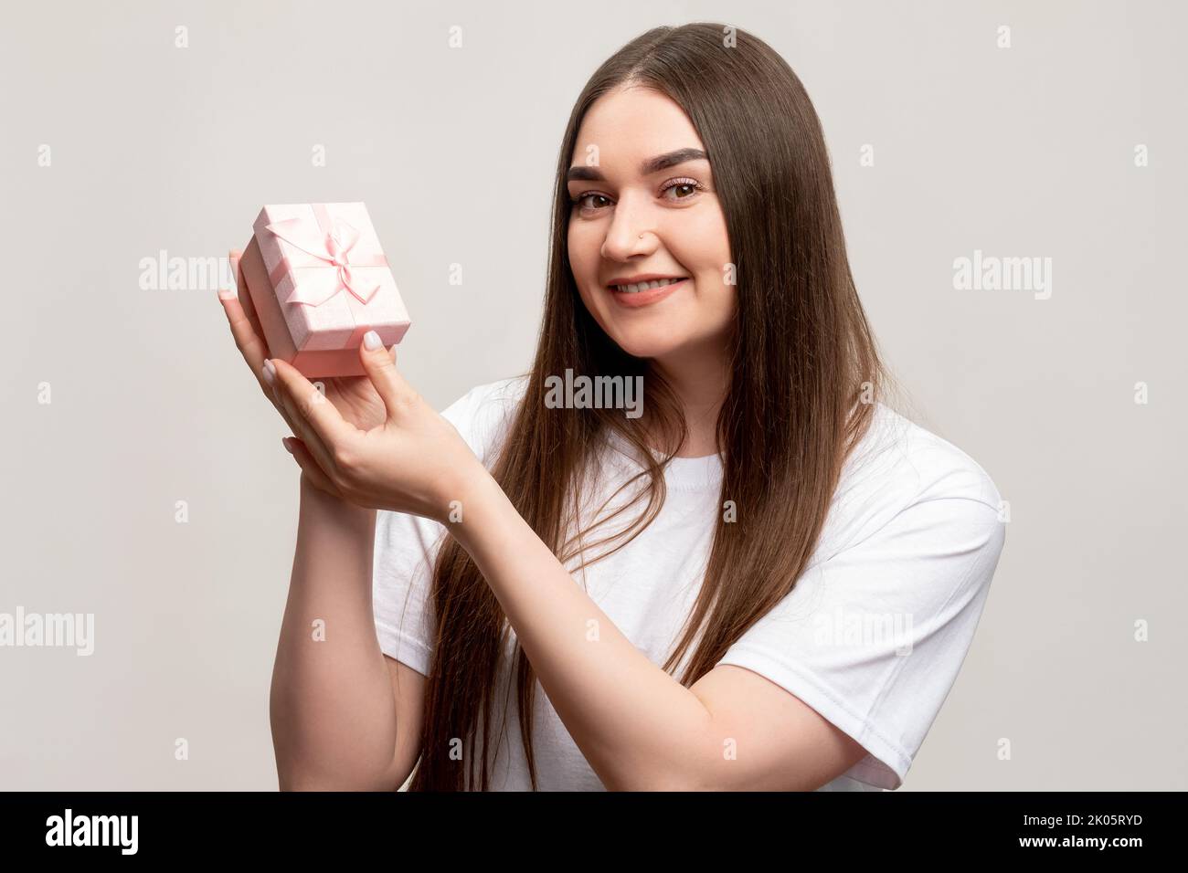 holiday surprise happy overweight woman gift box Stock Photo - Alamy
