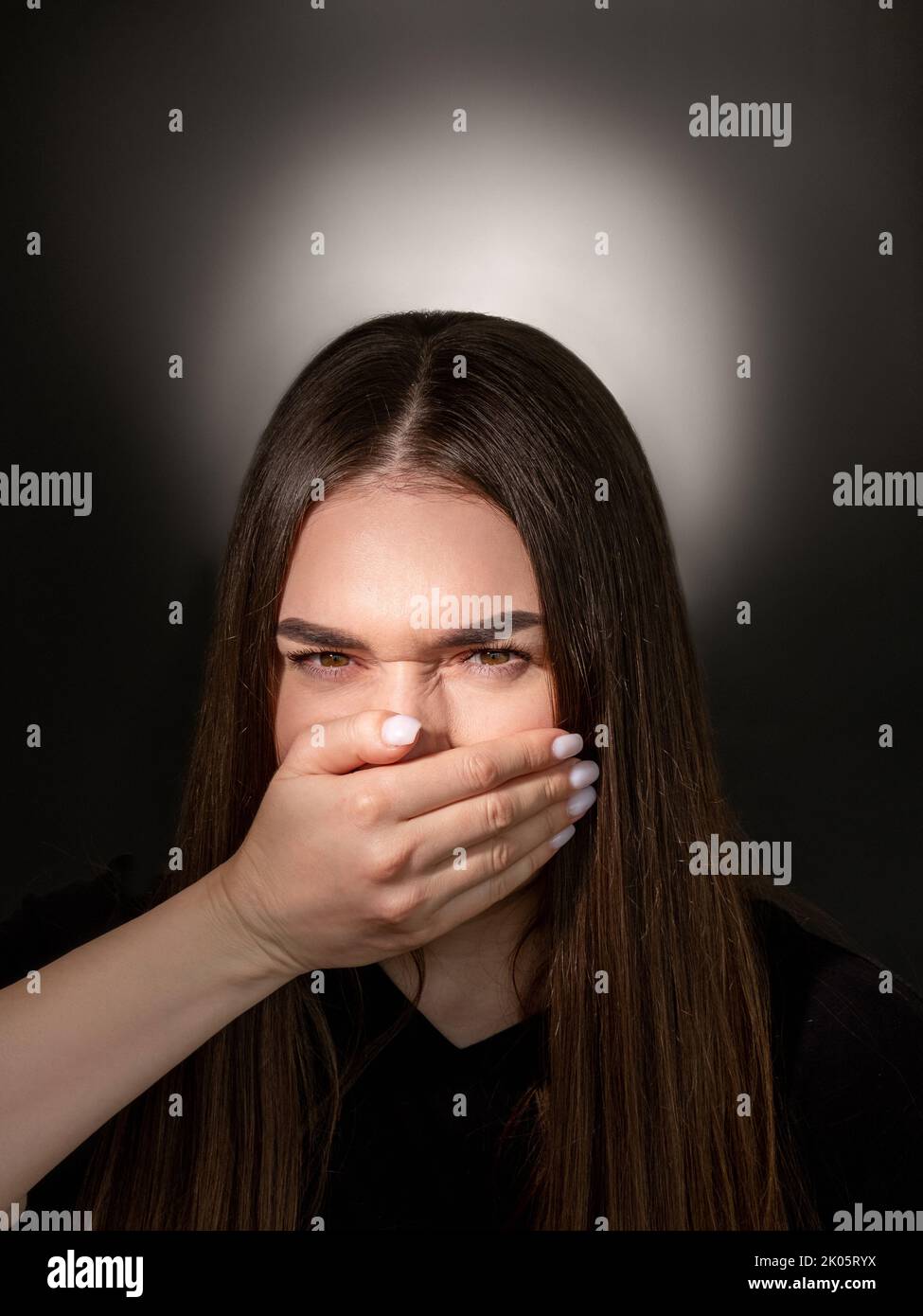 keep quiet family abuse mad woman covering mouth Stock Photo - Alamy