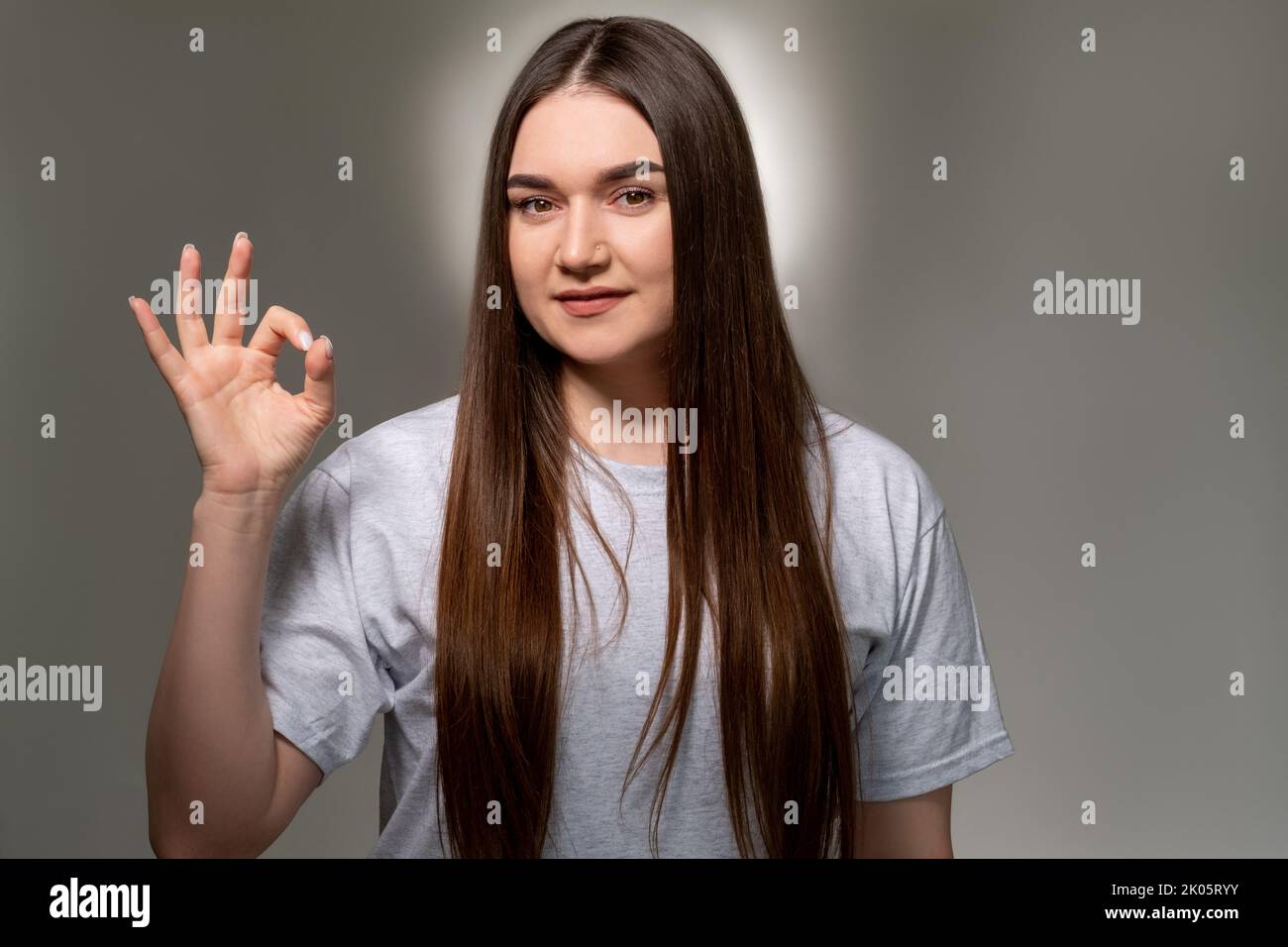 self acceptance ok sign confident overweight woman Stock Photo - Alamy