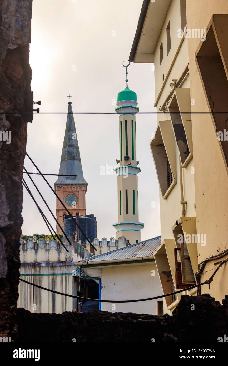 Christian church and minaret of the mosque side by side in Stone Town ...