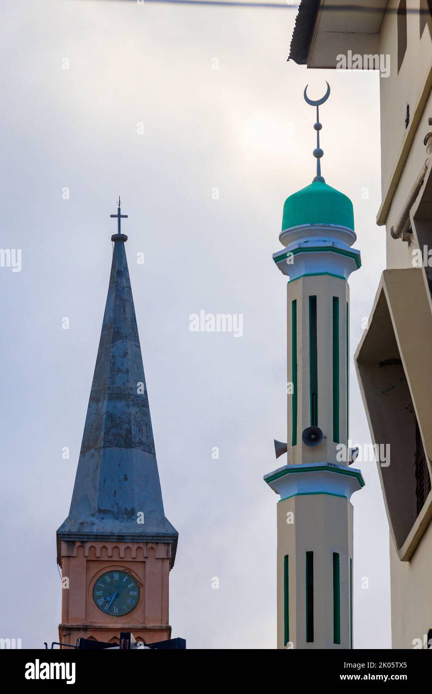 Christian church and minaret of the mosque side by side in Stone Town ...