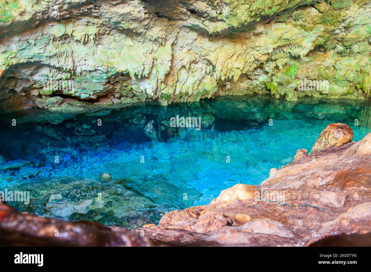View of beautiful natural pool of crystal clear water formed in a rocky ...