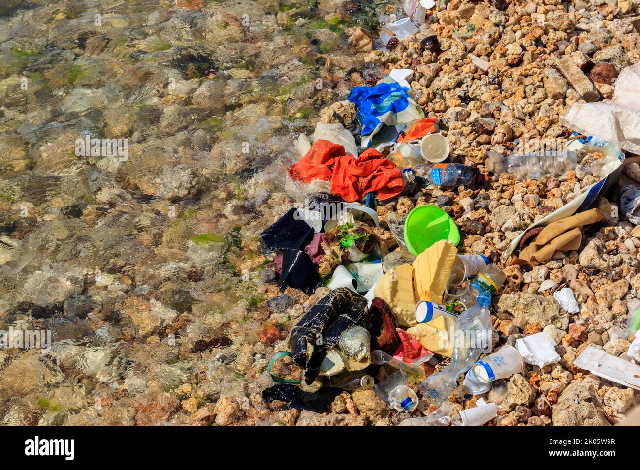 Garbage on a bank of ocean. Pollution of sea, ocean water with waste ...