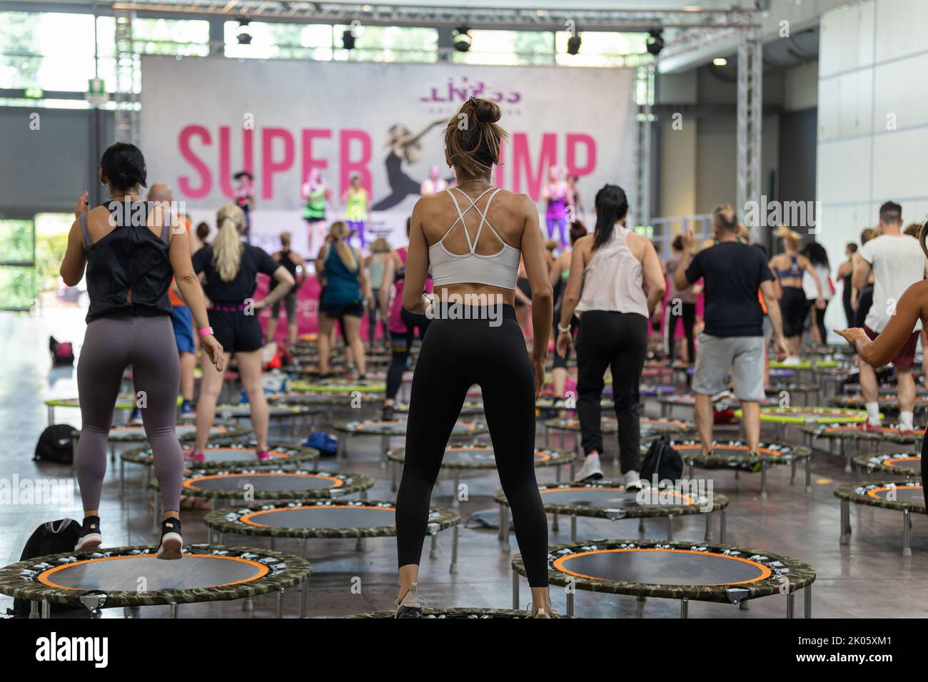 Single Rebounder Workout - People doing Fitness Exercise in Class at Gym with Music and Teacher ...