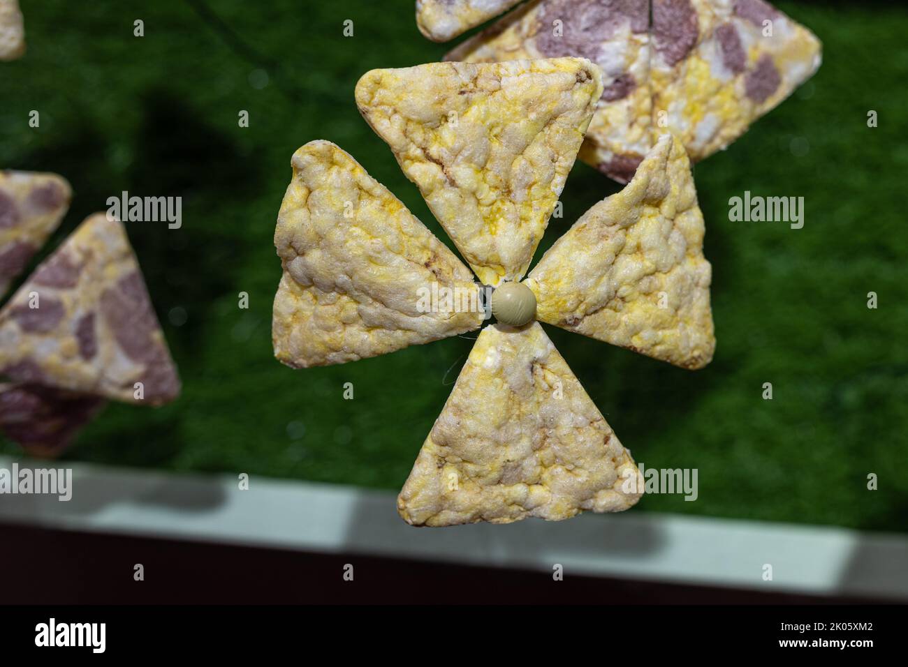 Rice and Cheese Appetizers in a Triangular Shape arranged to Create a ...
