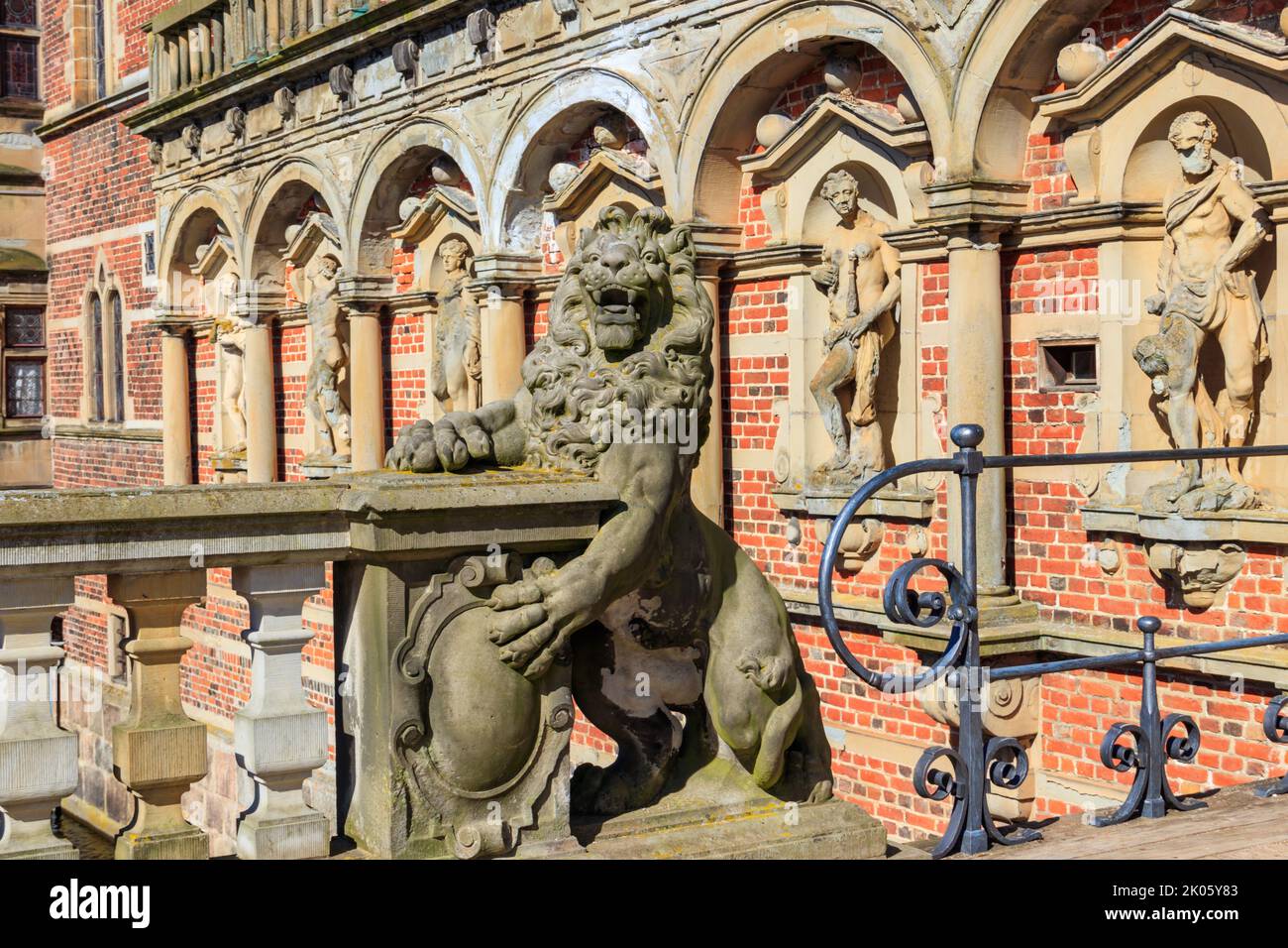Statue of lion at the entrance to Frederiksborg castle in Hillerod ...