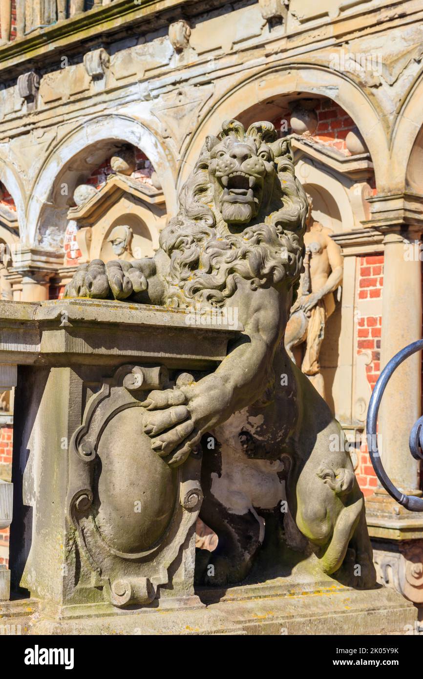 Statue of lion at the entrance to Frederiksborg castle in Hillerod ...