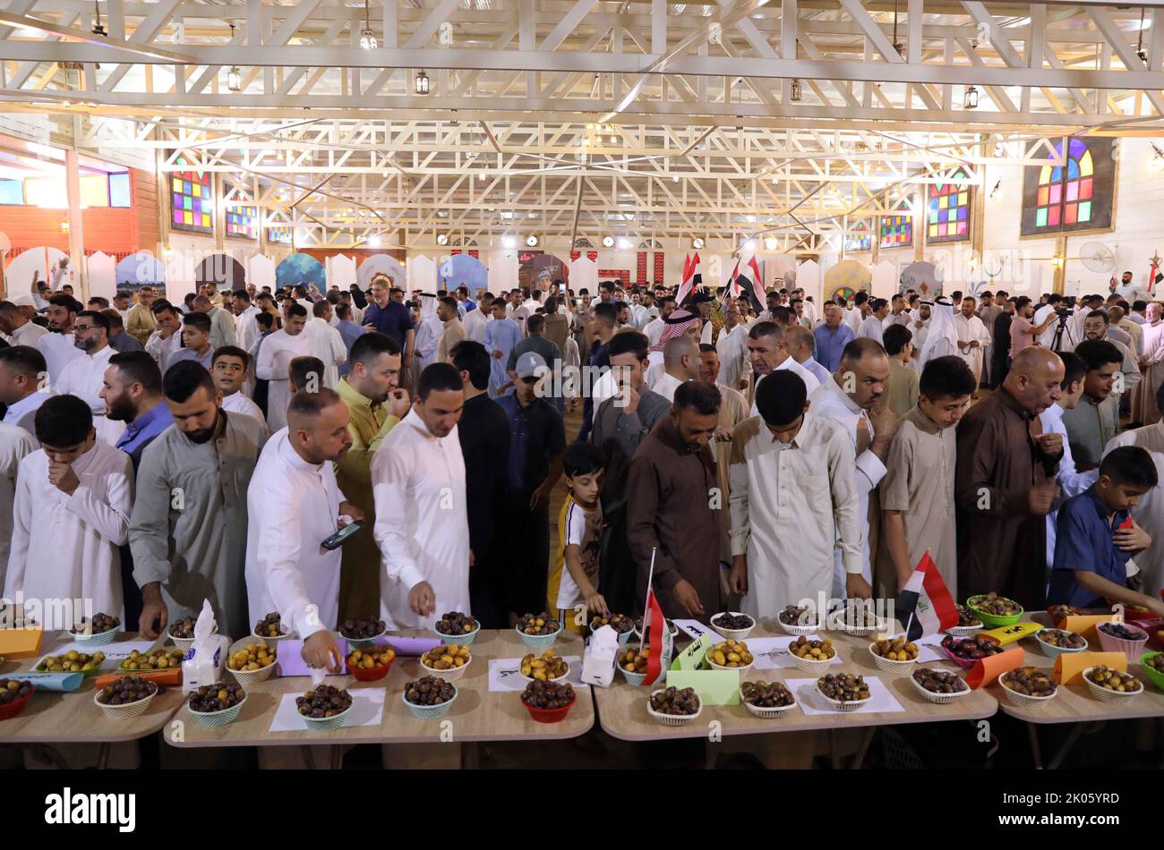 Baghdad, Iraq. 9th Sep, 2022. Visitors taste different types of dates ...