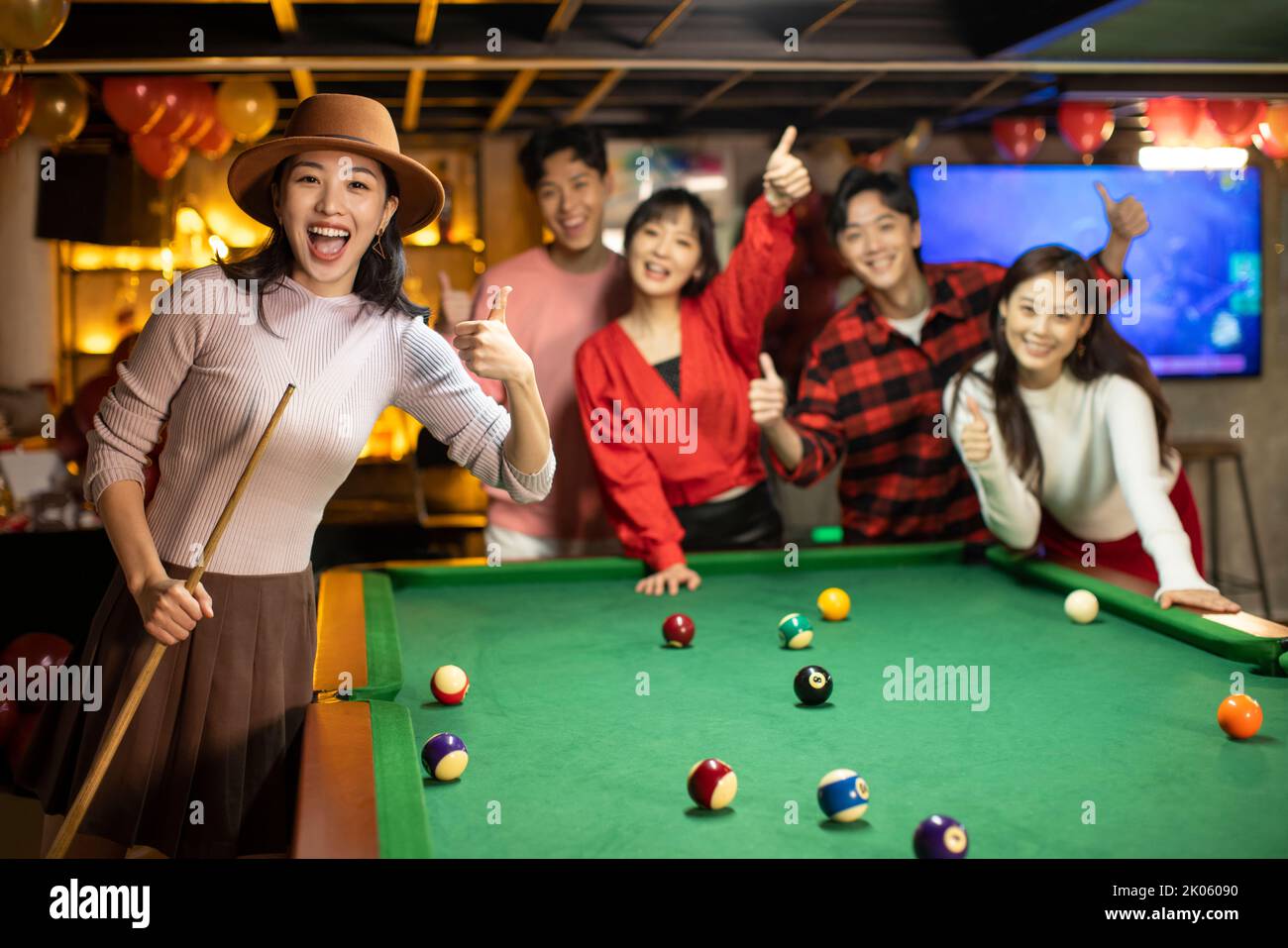 Happy young Chinese friends playing billiard together Stock Photo - Alamy