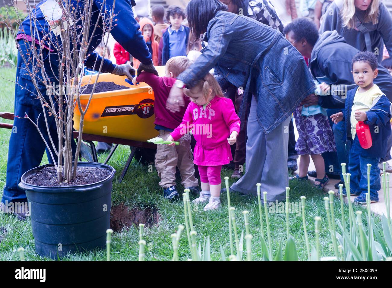 Earth Day tree planting event, with children outside HUD headquarters ...