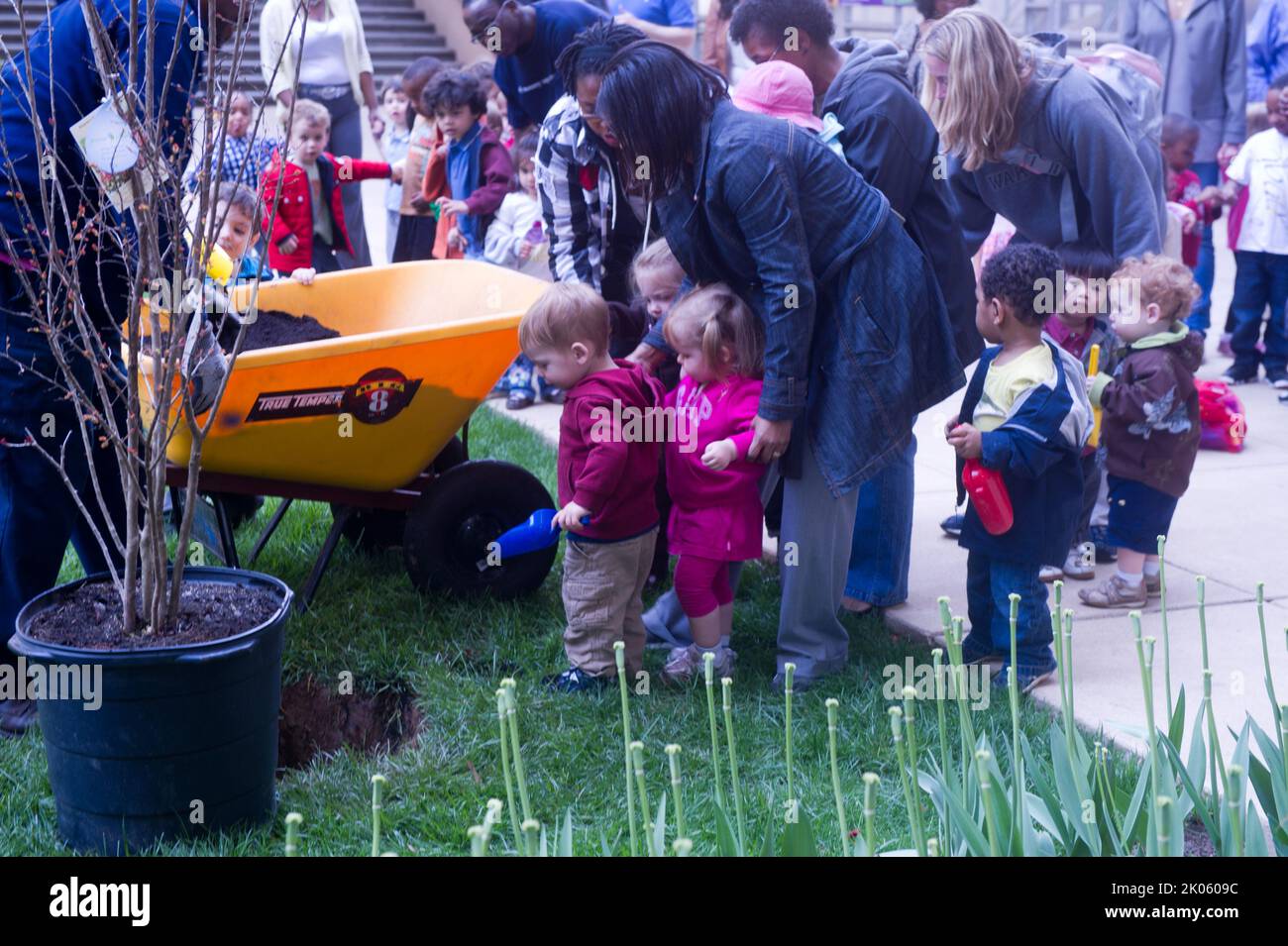 Earth Day tree planting event, with children outside HUD headquarters ...