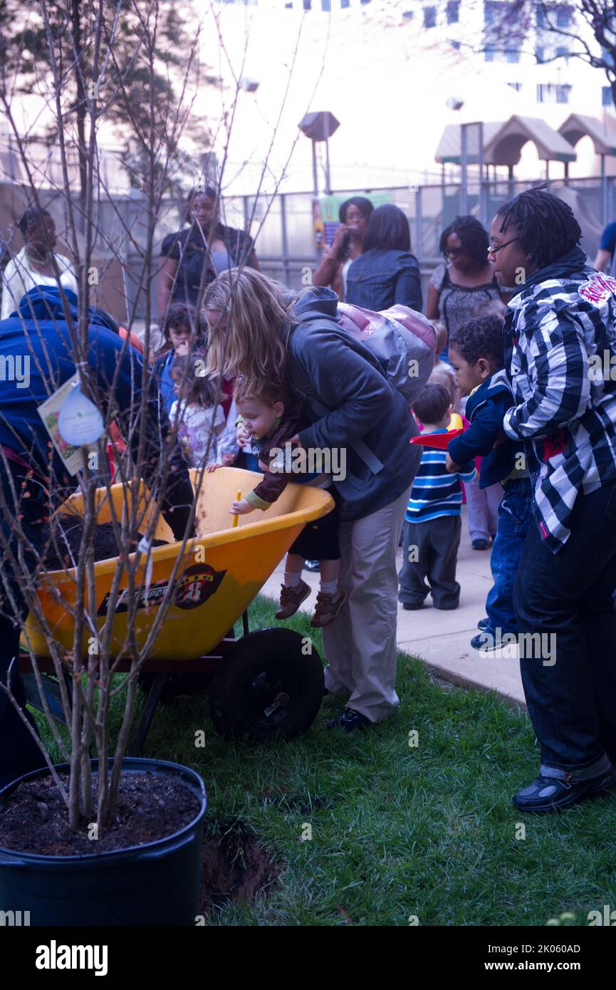 Earth Day tree planting event, with children outside HUD headquarters ...