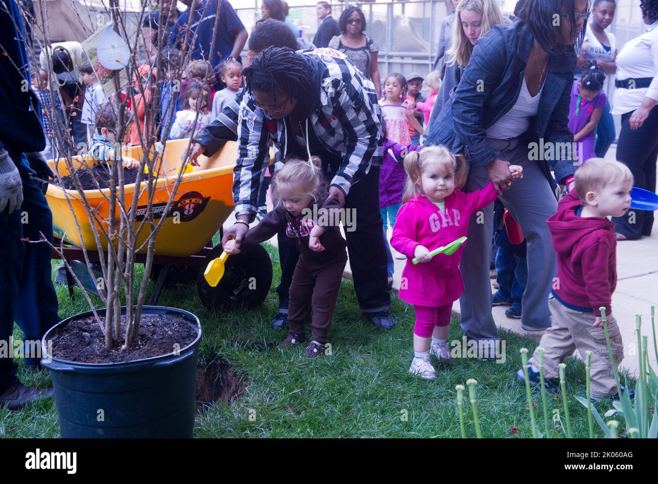 Earth Day tree planting event, with children outside HUD headquarters ...