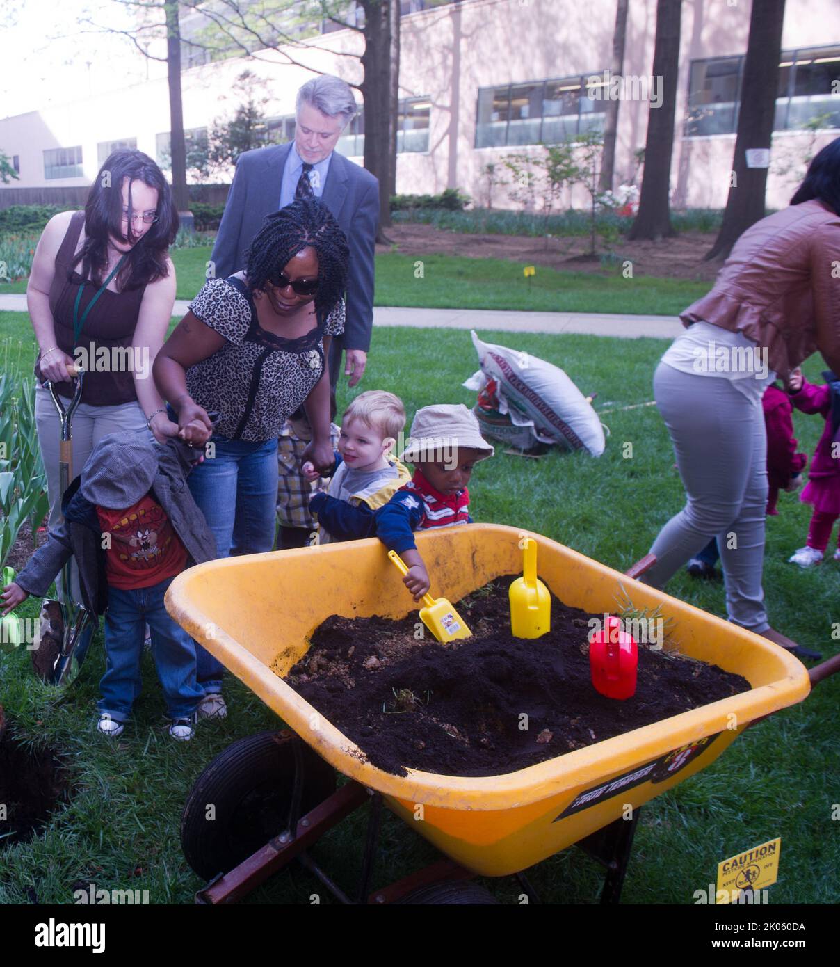 Earth Day tree planting event, with children outside HUD headquarters ...