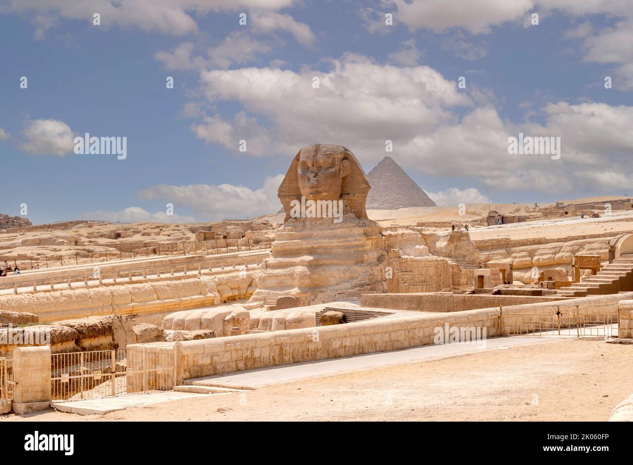 Sphinx of Giza in the desert of Cairo with the pyramid of Menkaure in ...