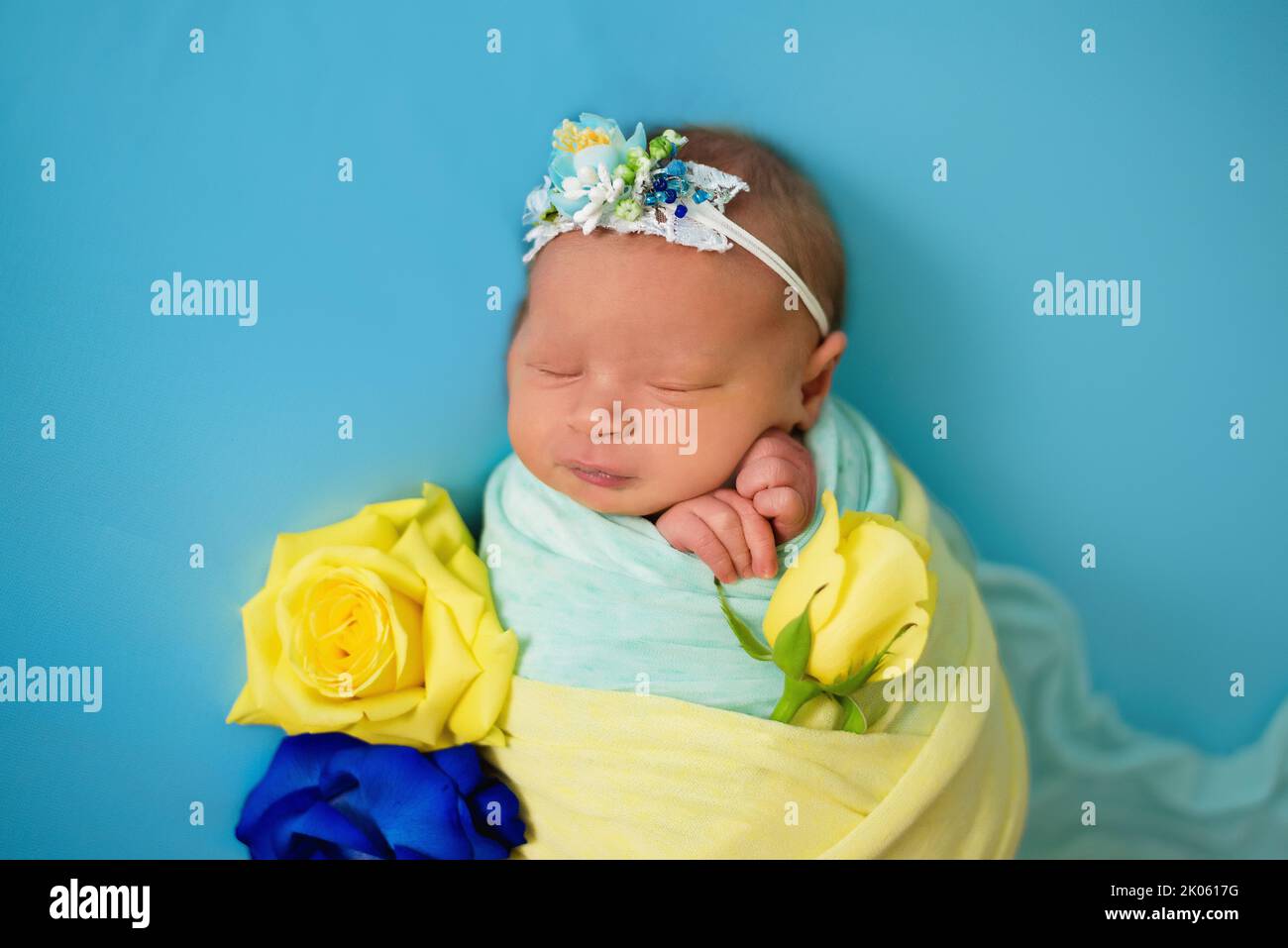 Ukrainian newborn in the studio patriotic blue yellow colors during the ...