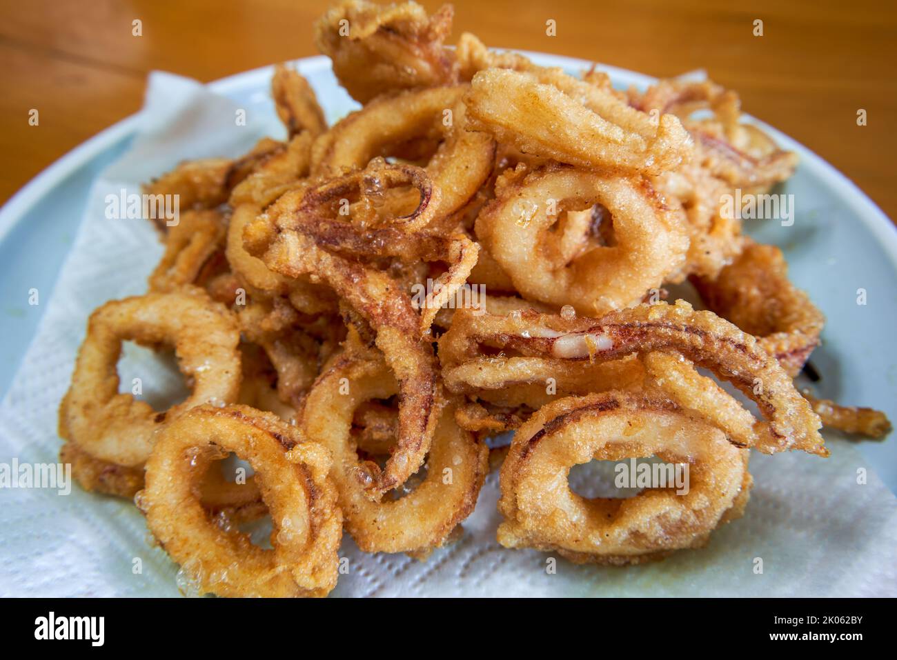 Crispy and tempting fried squid rings Stock Photo - Alamy