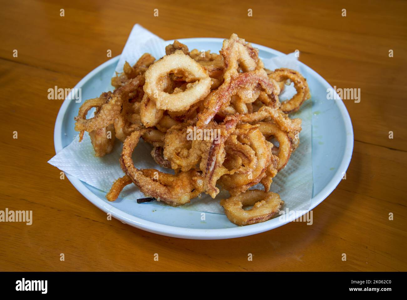Crispy and tempting fried squid rings Stock Photo - Alamy