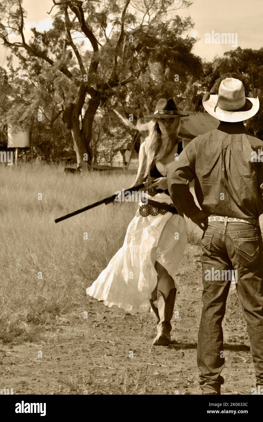 Cowboy riding horse gun hi-res stock photography and images - Alamy