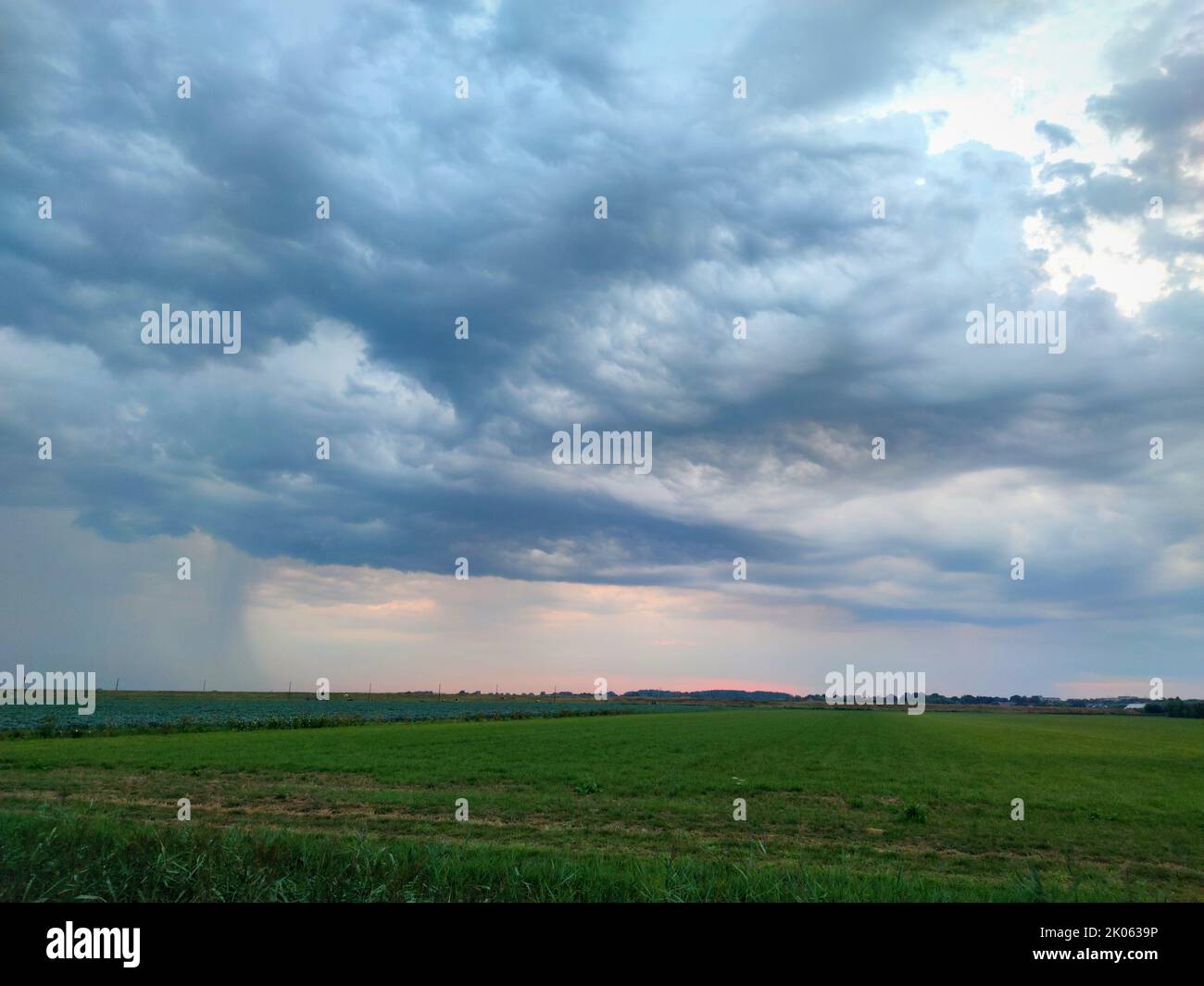 Storm clouds over grass plains hi-res stock photography and images - Alamy