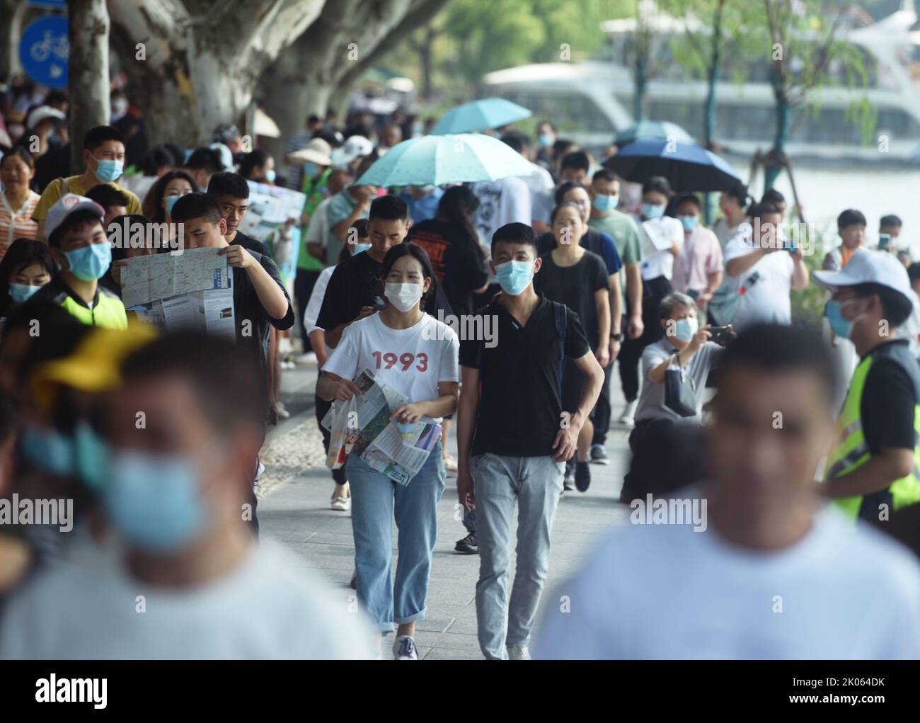 HANGZHOU, CHINA - SEPTEMBER 10, 2022 - Tourists visit the West Lake ...