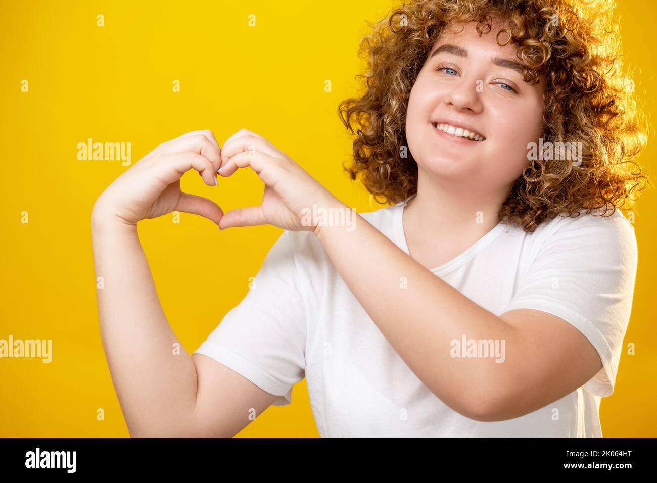 love gesture body positive overweight woman heart Stock Photo - Alamy