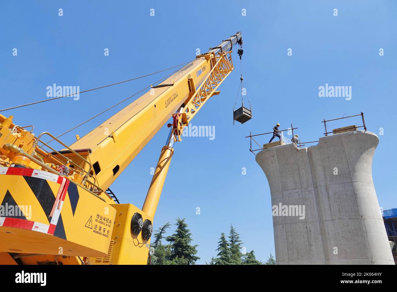 YANTAI, CHINA - SEPTEMBER 10, 2022 - Construction workers pour stones ...