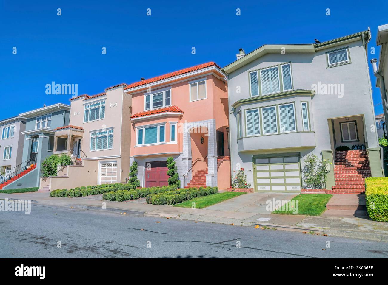 Three-storey houses exterior view against blue sky in San Francisco ...