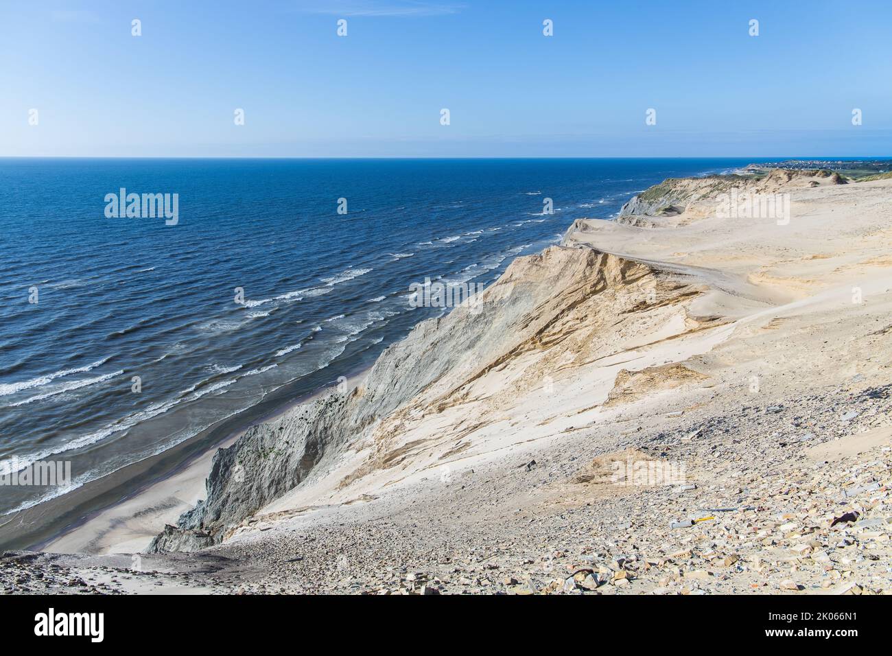 The iconic coast line in Denmark with rocks, sand dunes and the ocean ...