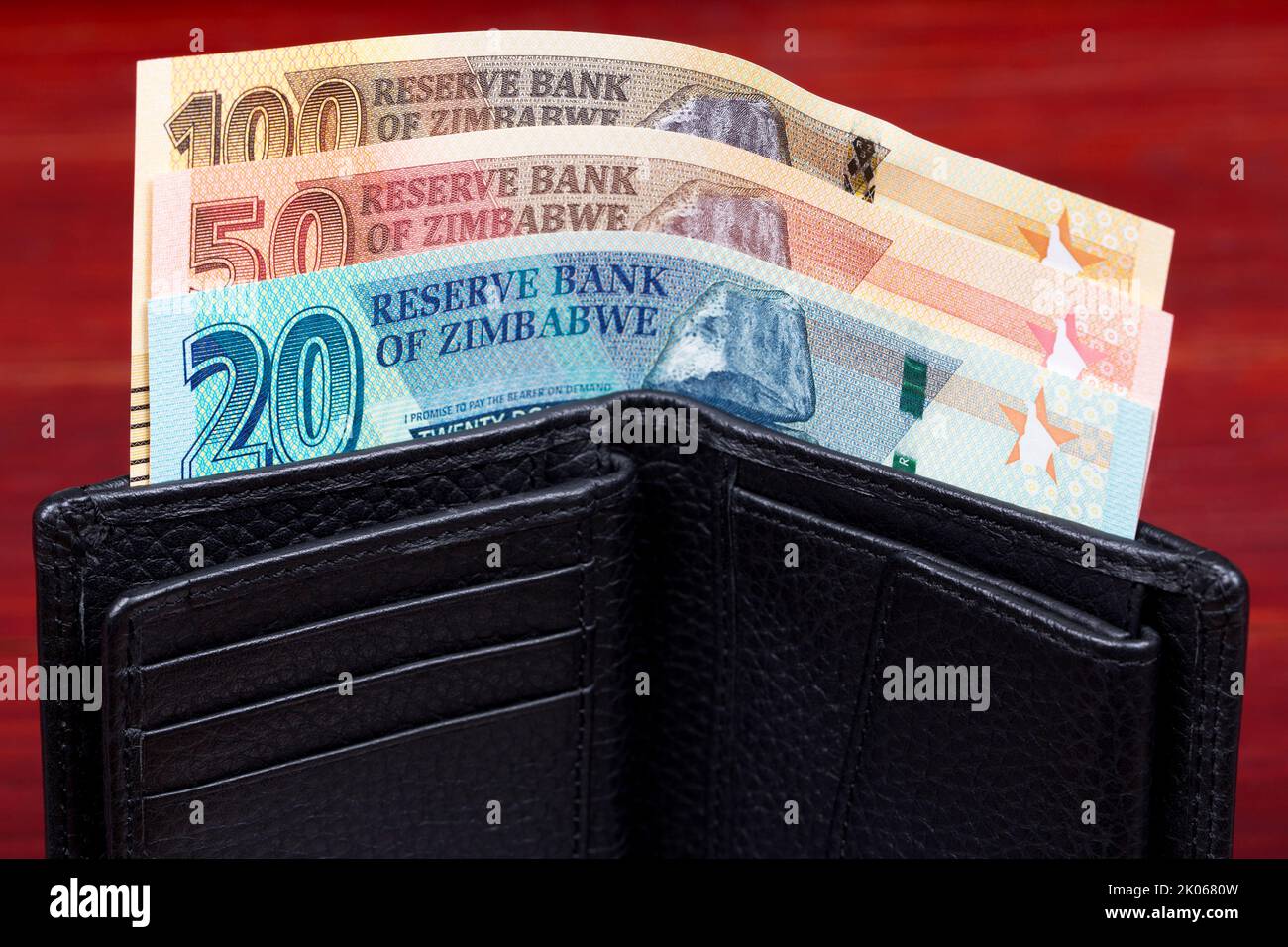 Zimbabwean money in the black wallet - a new serie of banknotes Stock ...