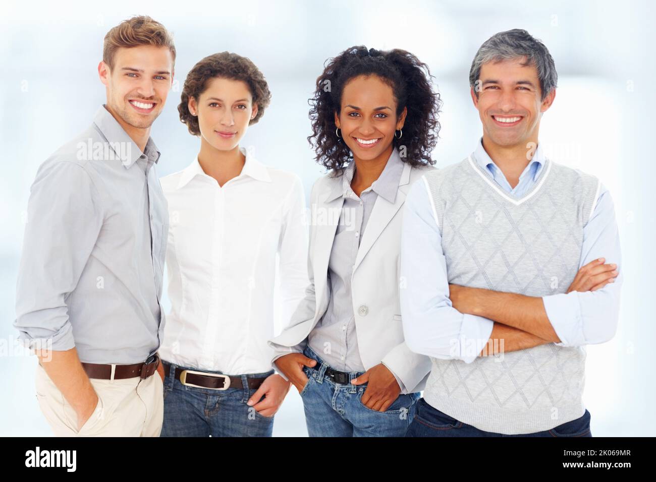 Successful business people. Portrait of four business partners standing ...