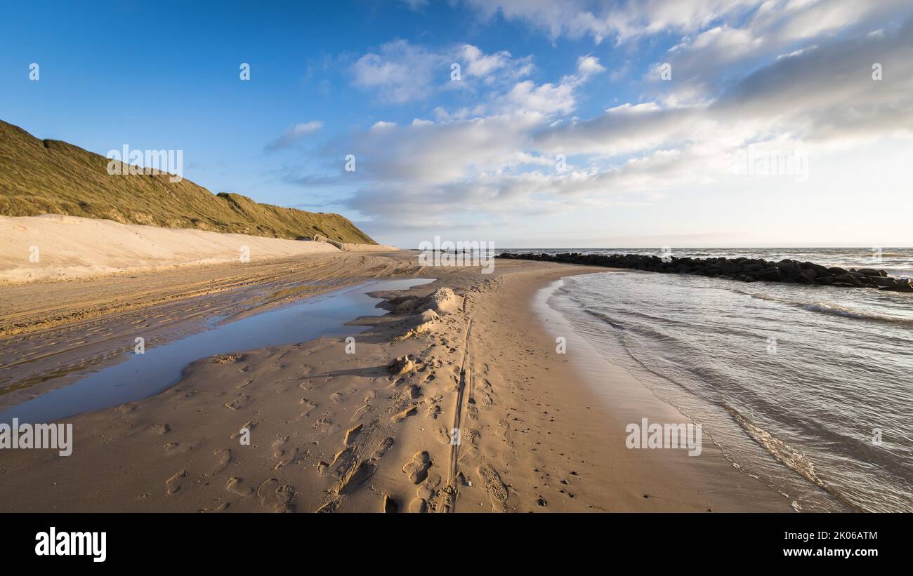 A beautiful sand beach at the coast of northern Denmark in the evening ...