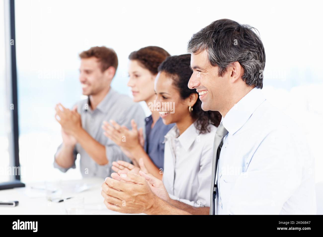 Applauding our success. Profile shot of a group of young business ...