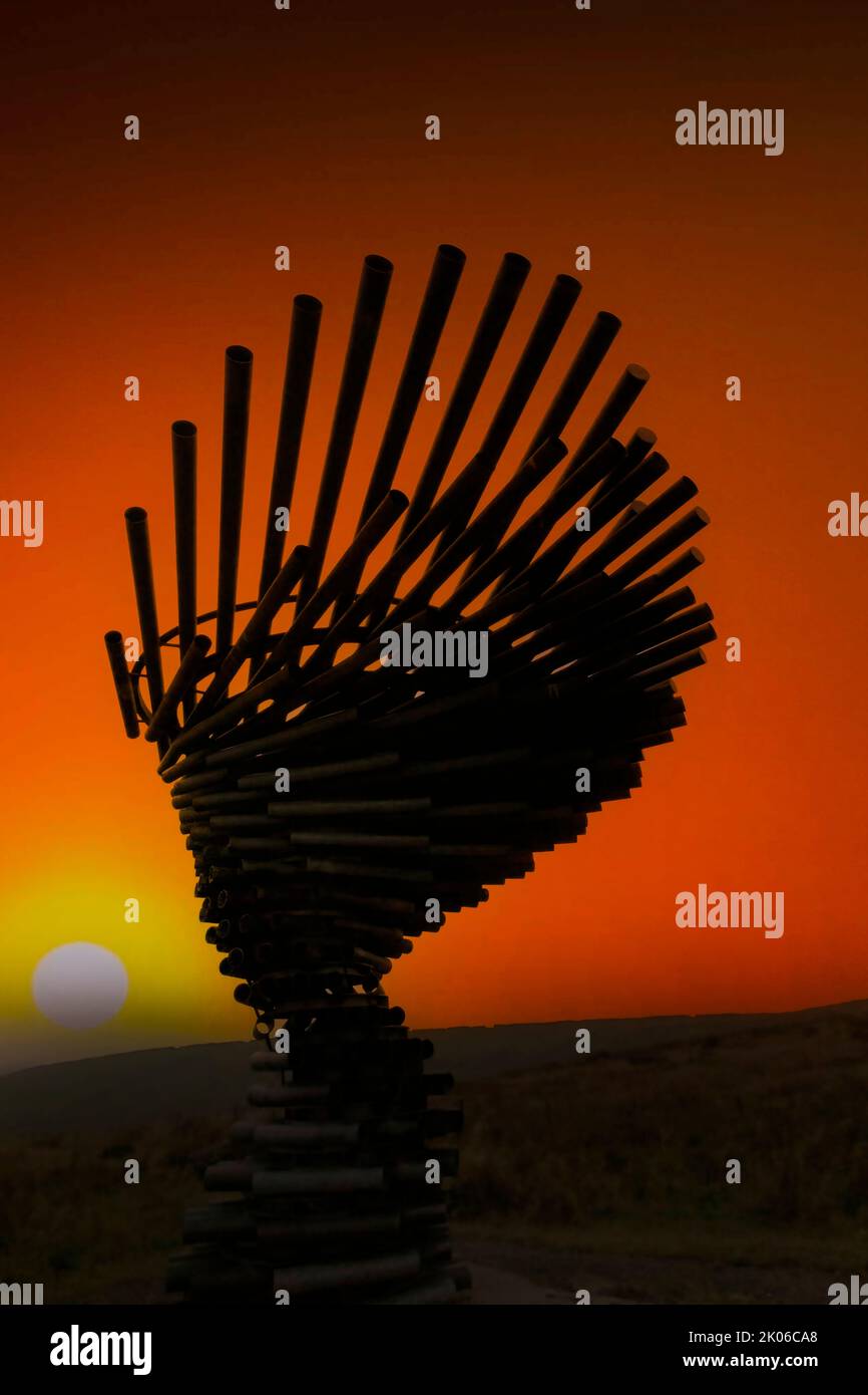 The silhouette of the Ringing Singing Tree in Lancashire, UK against an ...