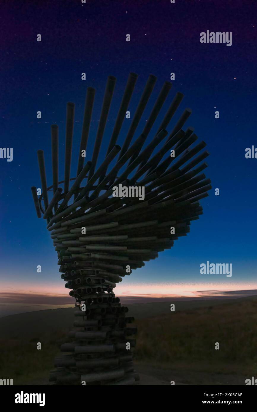 The silhouette of the Ringing Singing Tree near Burnley in Lancashire ...