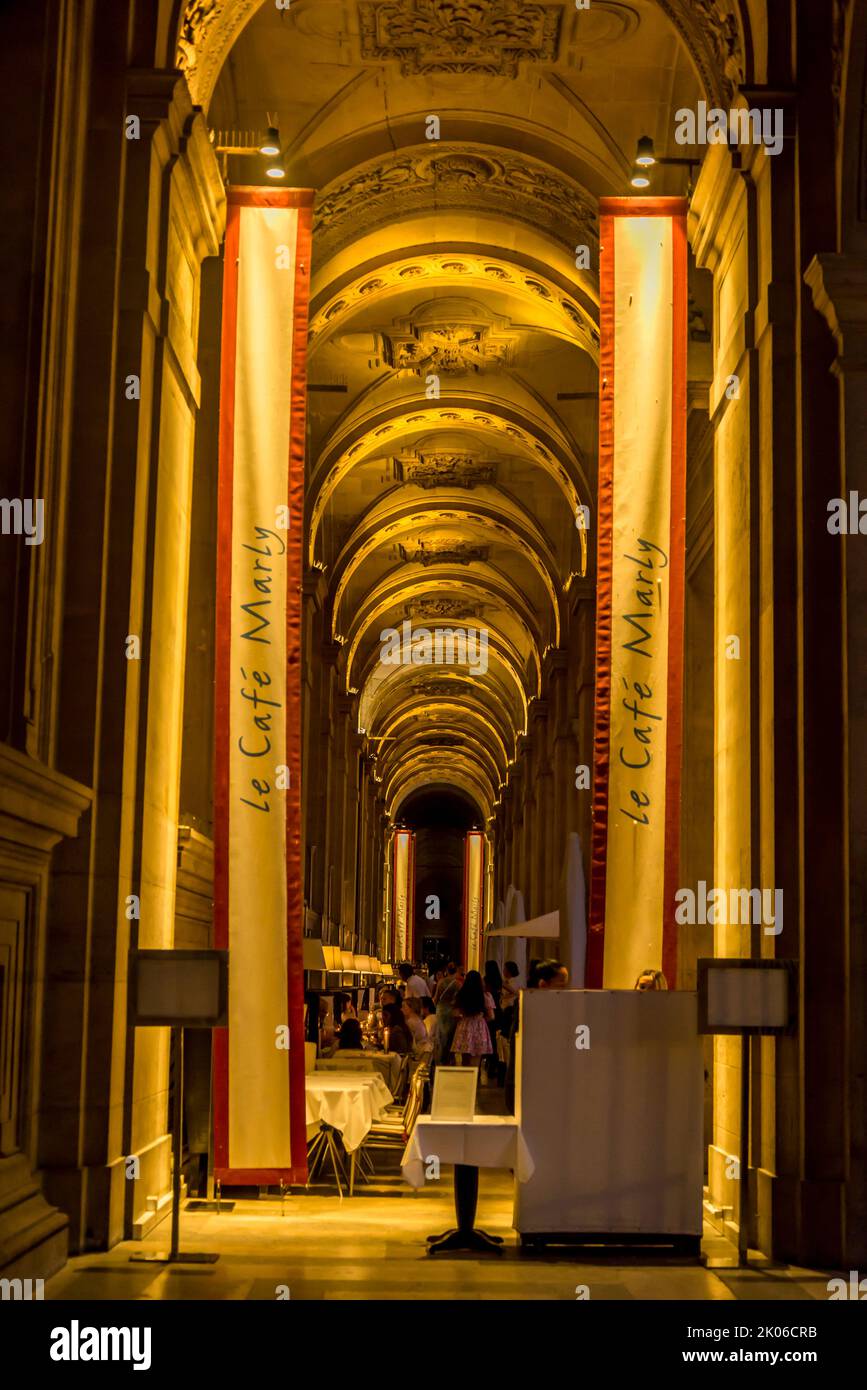 Le Café Marly, upscale dining in an open-air arched passageway, Paris ...