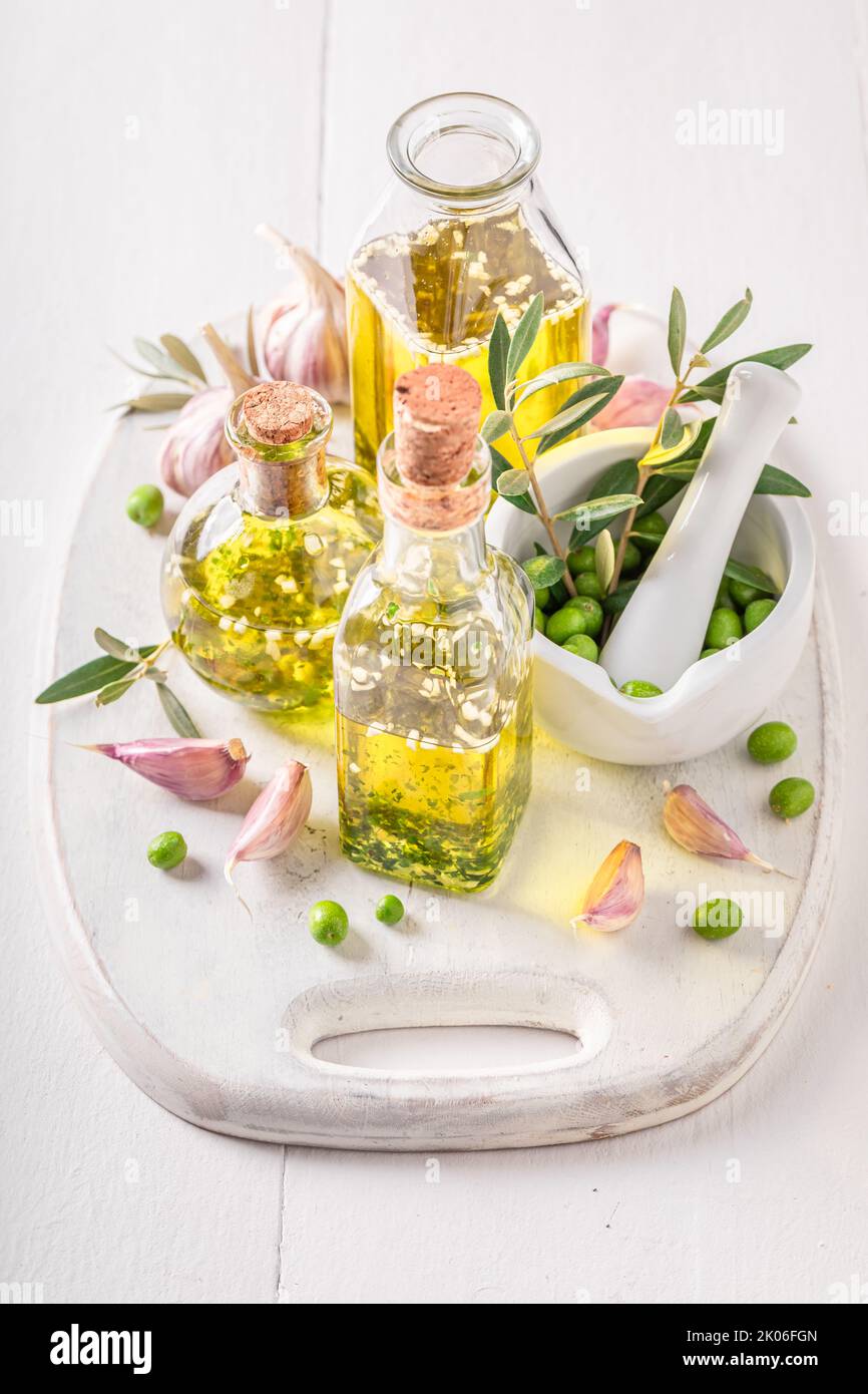Tasty and intense oil with garlic and herbs. Flavored oil in bottle ...