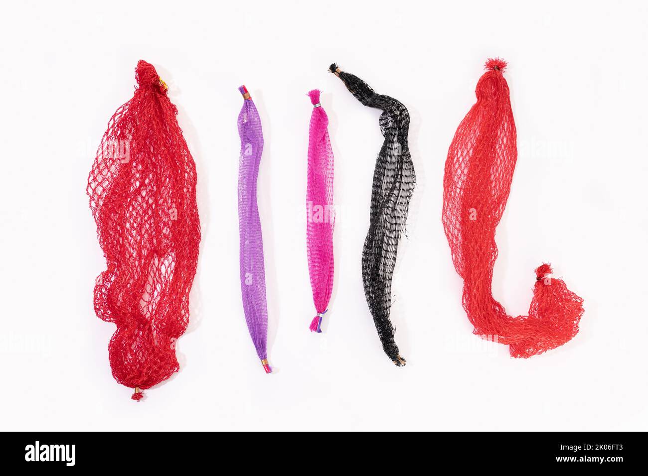 Group of empty plastic net bags isolated on white background. Food ...