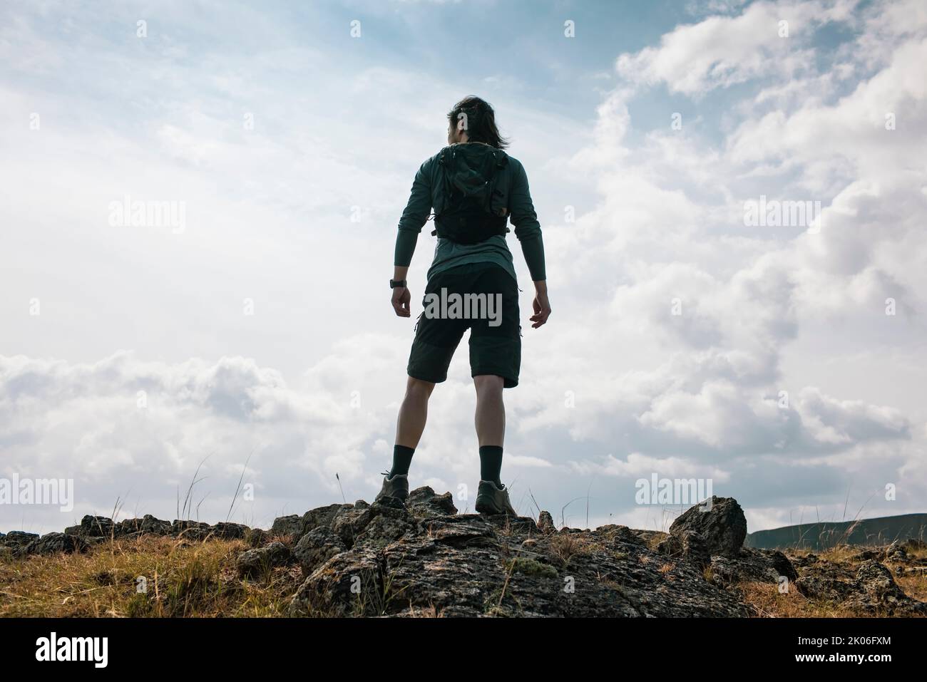 Rear view of Chinese male trail runner Stock Photo - Alamy
