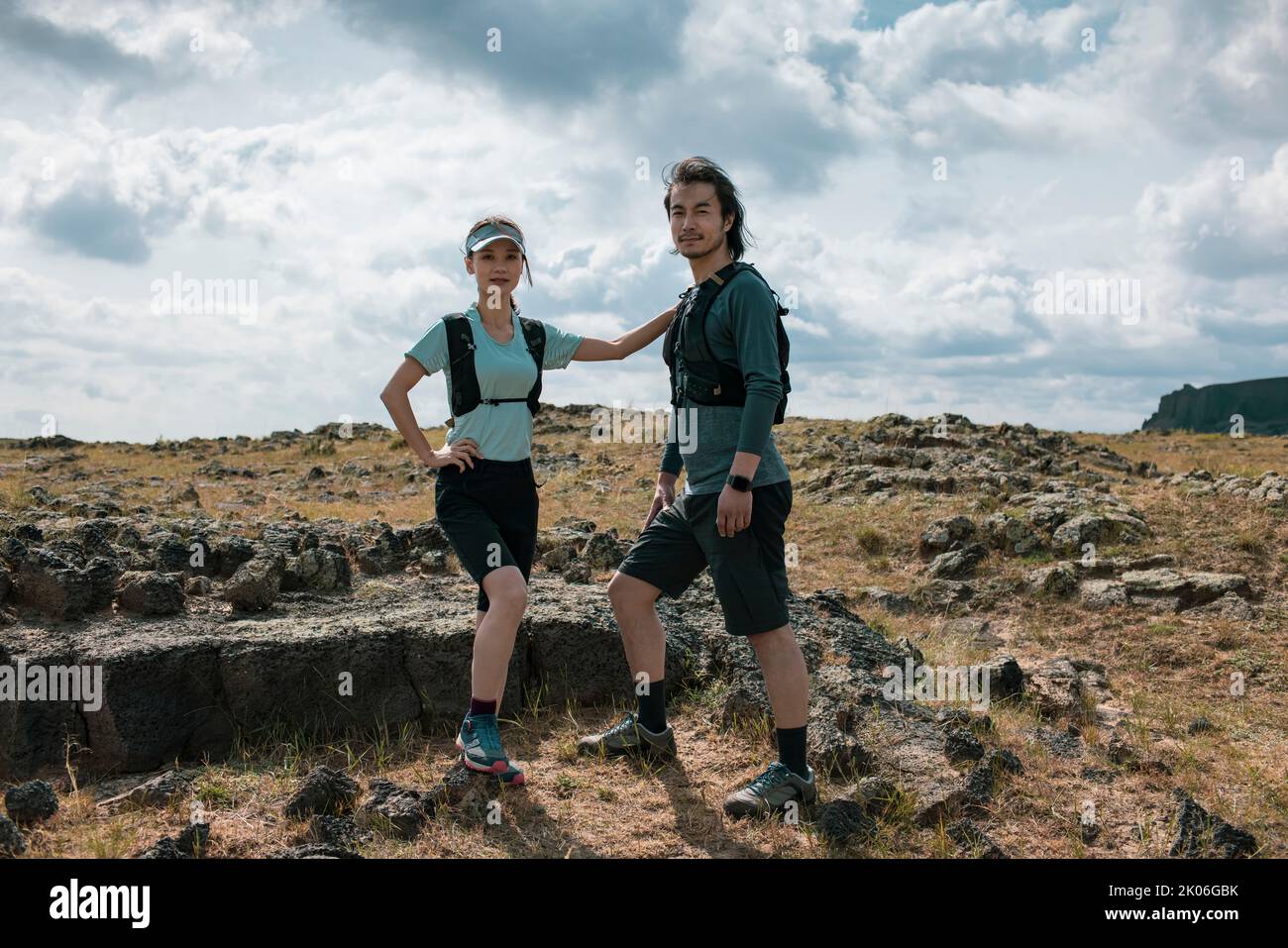 Happy Chinese couple trail running in nature Stock Photo - Alamy