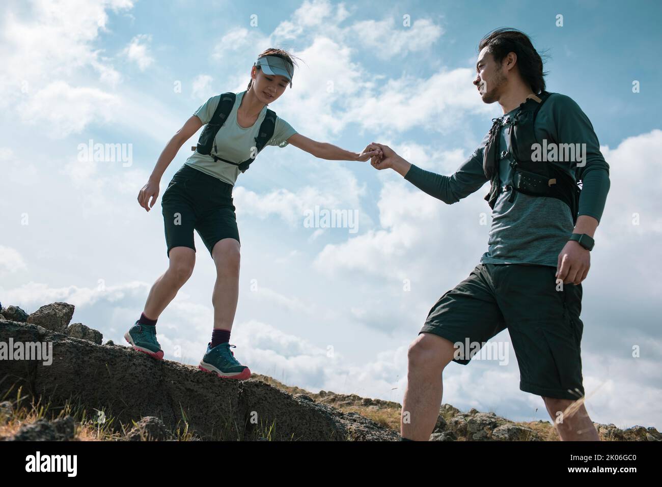 Happy Chinese couple trail running in nature Stock Photo - Alamy