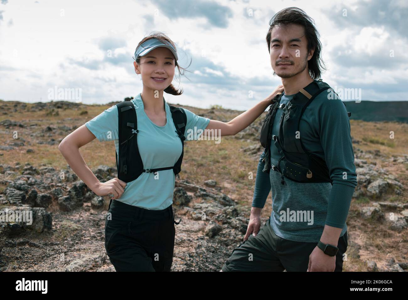 Happy Chinese couple trail running in nature Stock Photo - Alamy